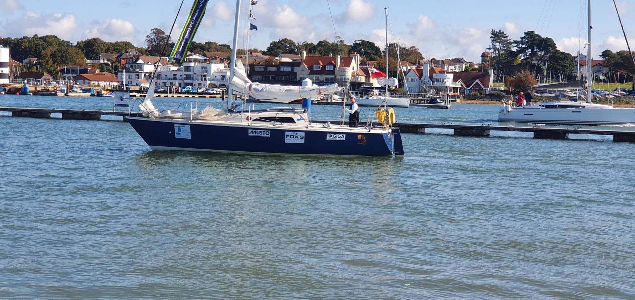Youngest person to sail round Britain arrives back to Hamble Point Marina